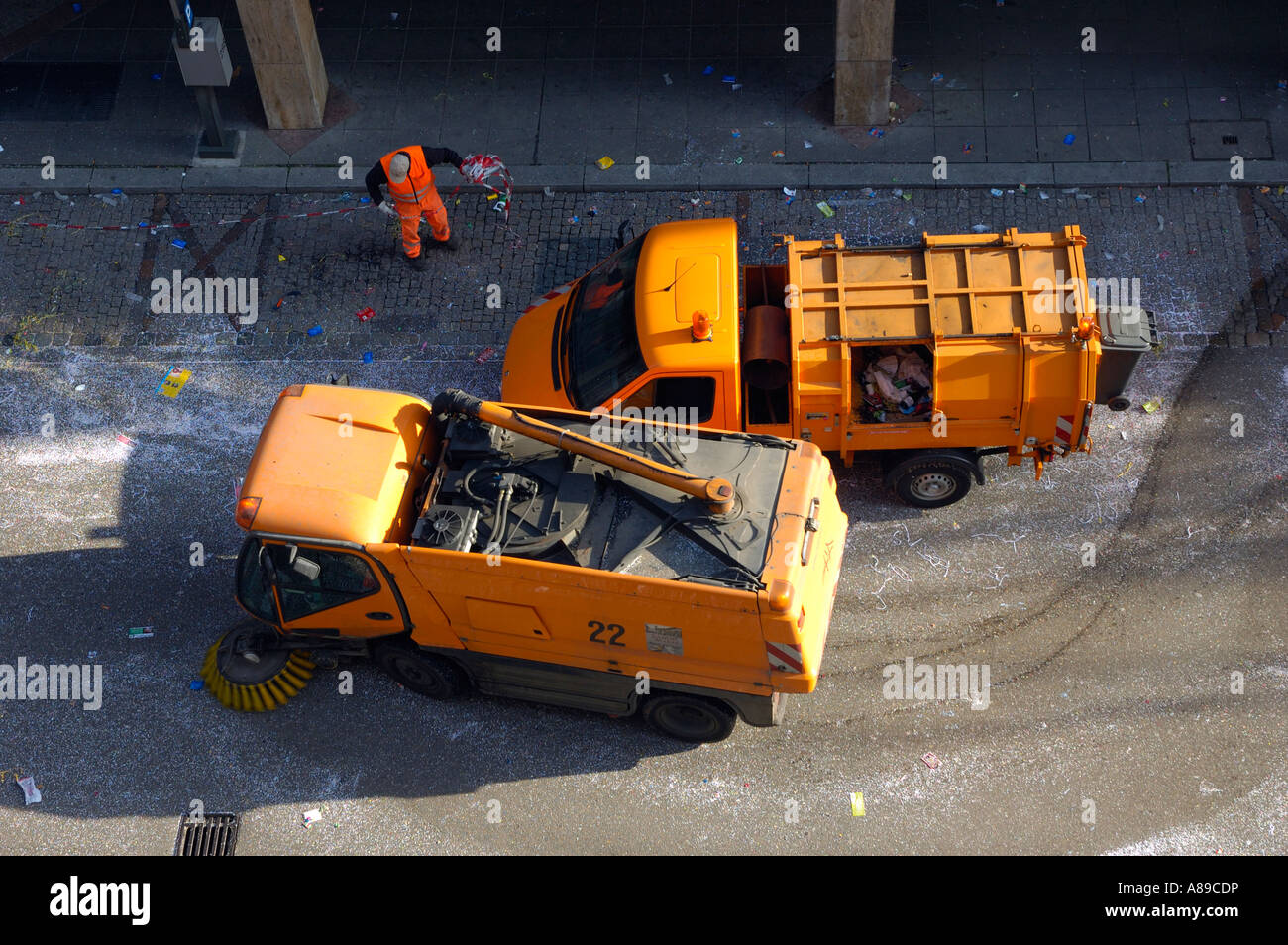 Road sweeper cleaning a street Stock Photo - Alamy