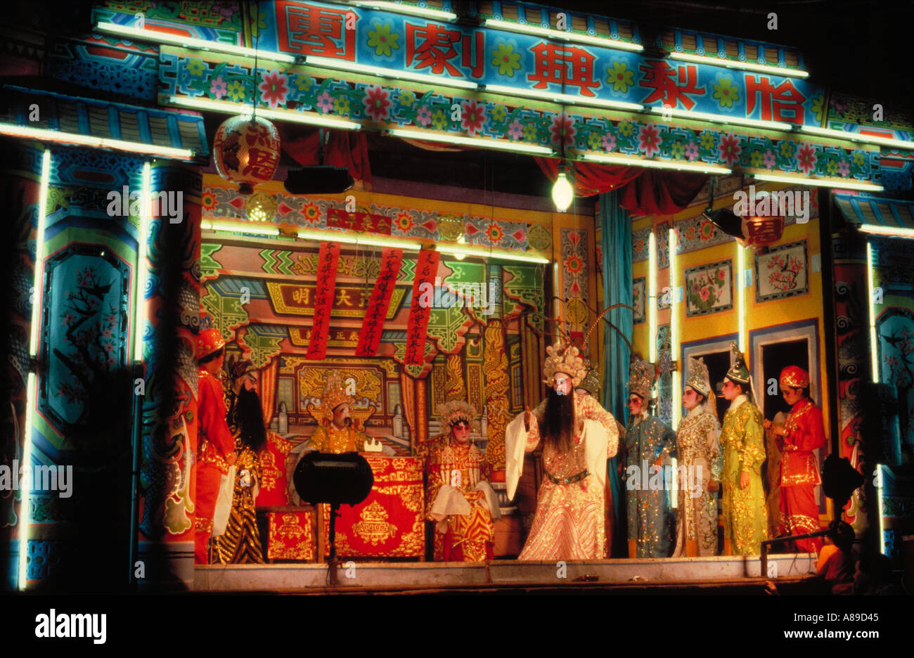 Actors wearing elaborate costumes performing in a Chinese Opera ...