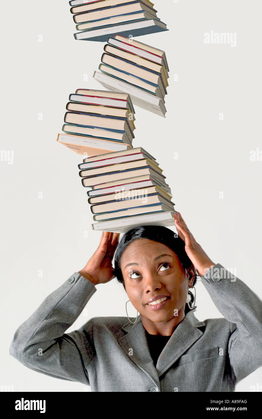 Woman balancing books head hi-res stock photography and images - Alamy