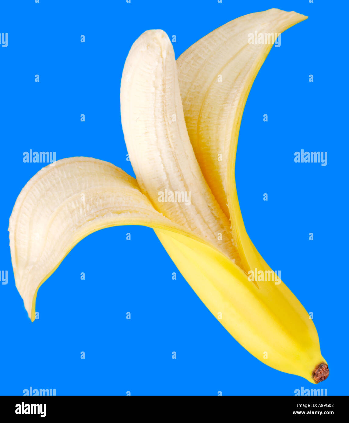 PEELED BANANA ON BLUE Stock Photo - Alamy