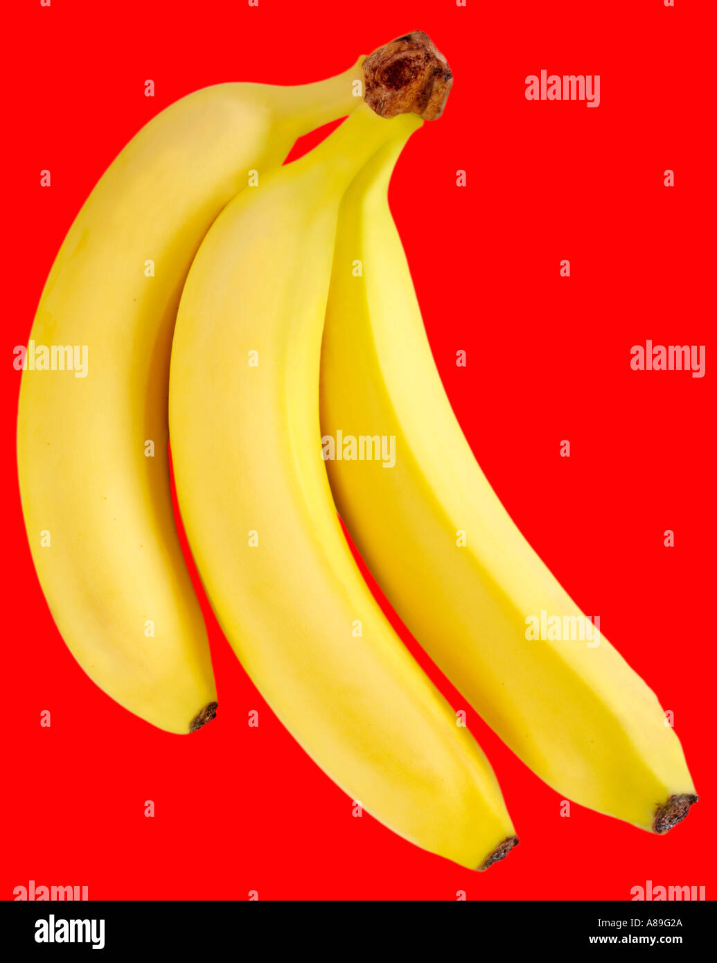 THREE BANANAS ON RED Stock Photo - Alamy