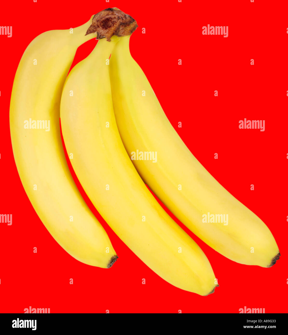 THREE BANANAS ON RED Stock Photo - Alamy