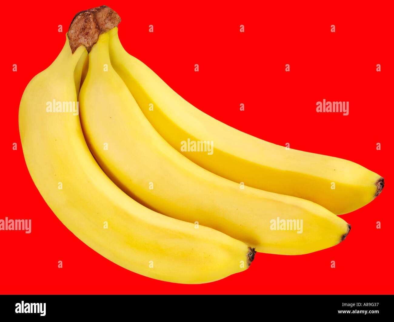 THREE BANANAS ON RED Stock Photo - Alamy