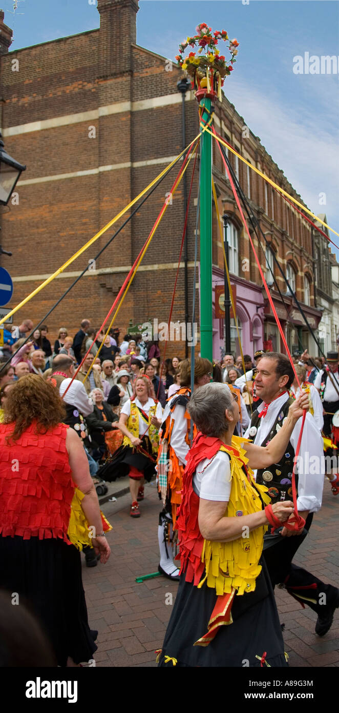 Morris dancers skipping around a Maypole at the Rochester Sweeps ...
