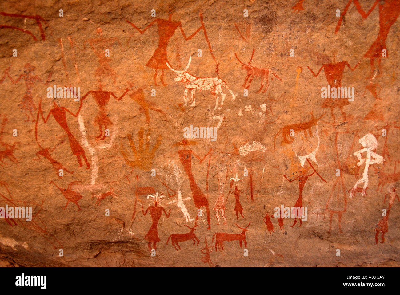 Neolithic rock drawing of humans and animals Acacus Libya Stock Photo ...