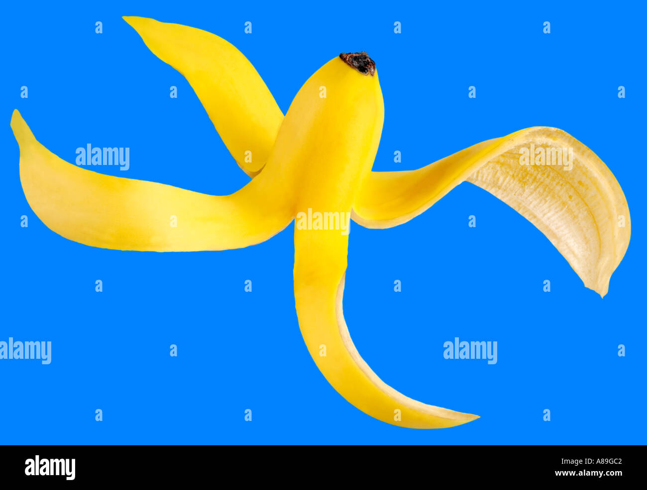BANANA SKIN ON BLUE Stock Photo - Alamy