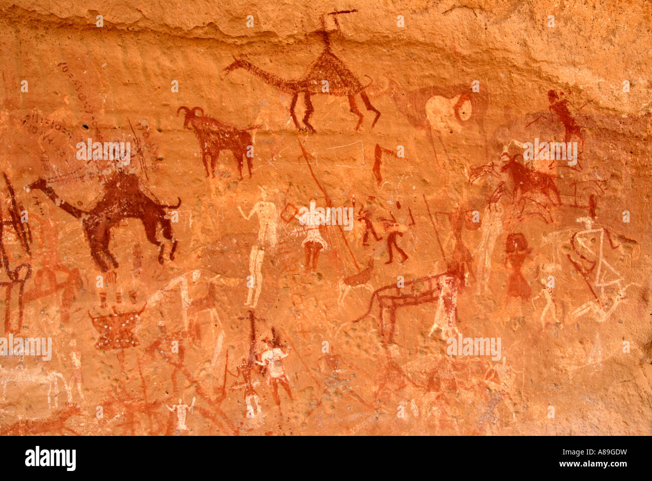 Neolithic rock drawing of humans and animals Acacus Libya Stock Photo ...