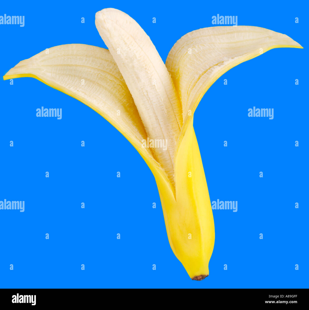 PEELED BANANA ON BLUE Stock Photo - Alamy