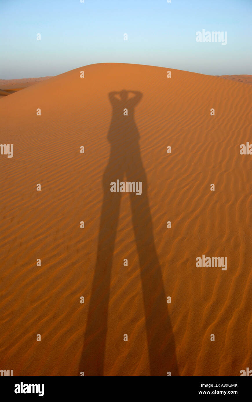 Human shadow with long legs in sand Mandara Libya Stock Photo - Alamy