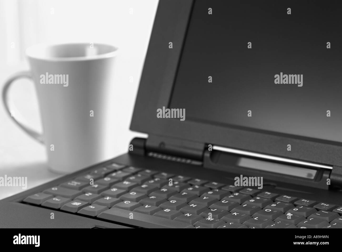 Laptop Computer and Coffee Cup Stock Photo - Alamy