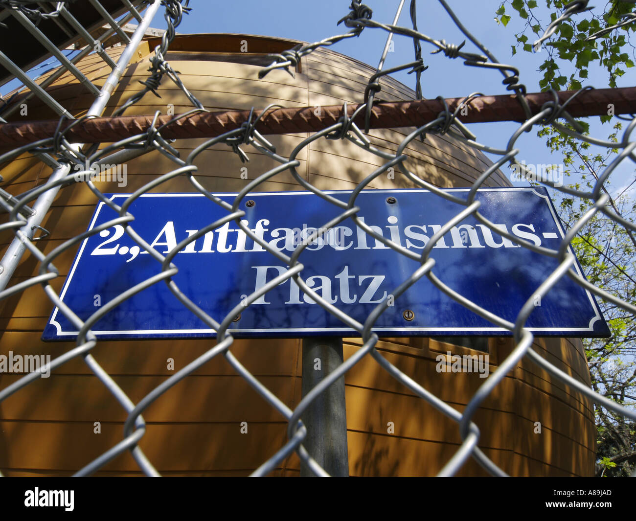 Vienna, Prater Sign Antifaschismus-Platz behind chain-link fence Stock ...