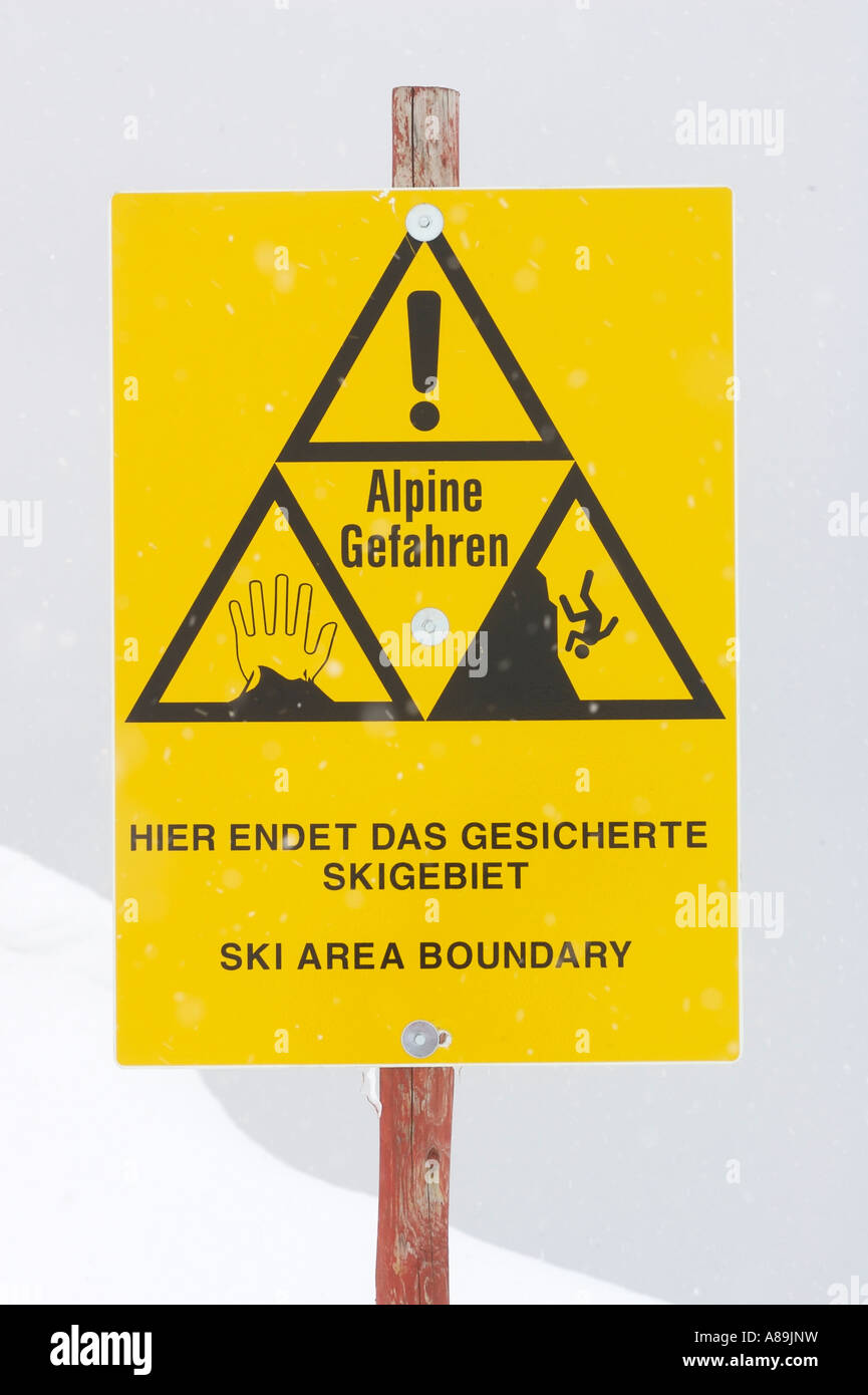 Warning sign about alpine dangers Stock Photo - Alamy