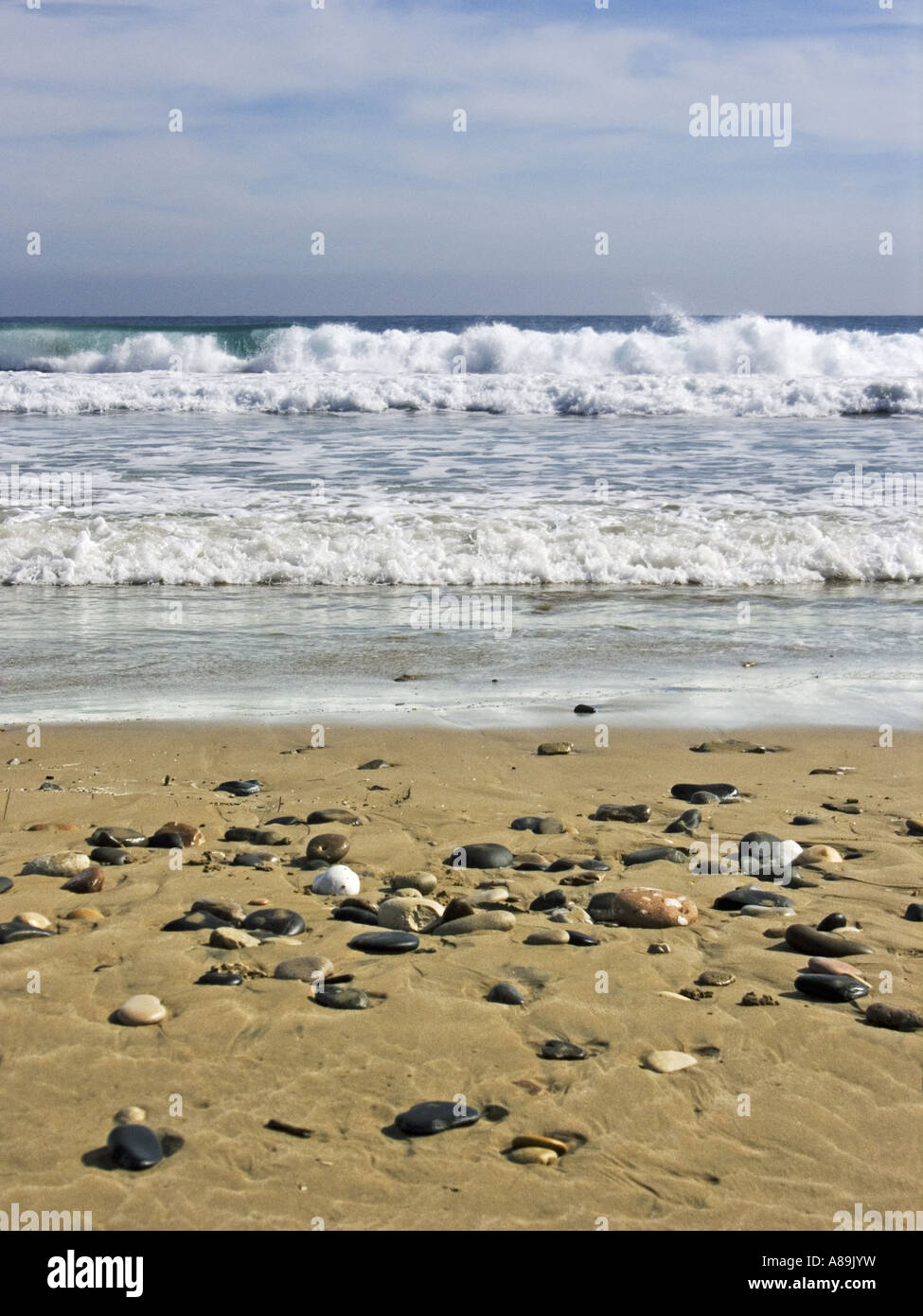 Colored pebbles on the sand beach of La Pineda, Spain Stock Photo - Alamy
