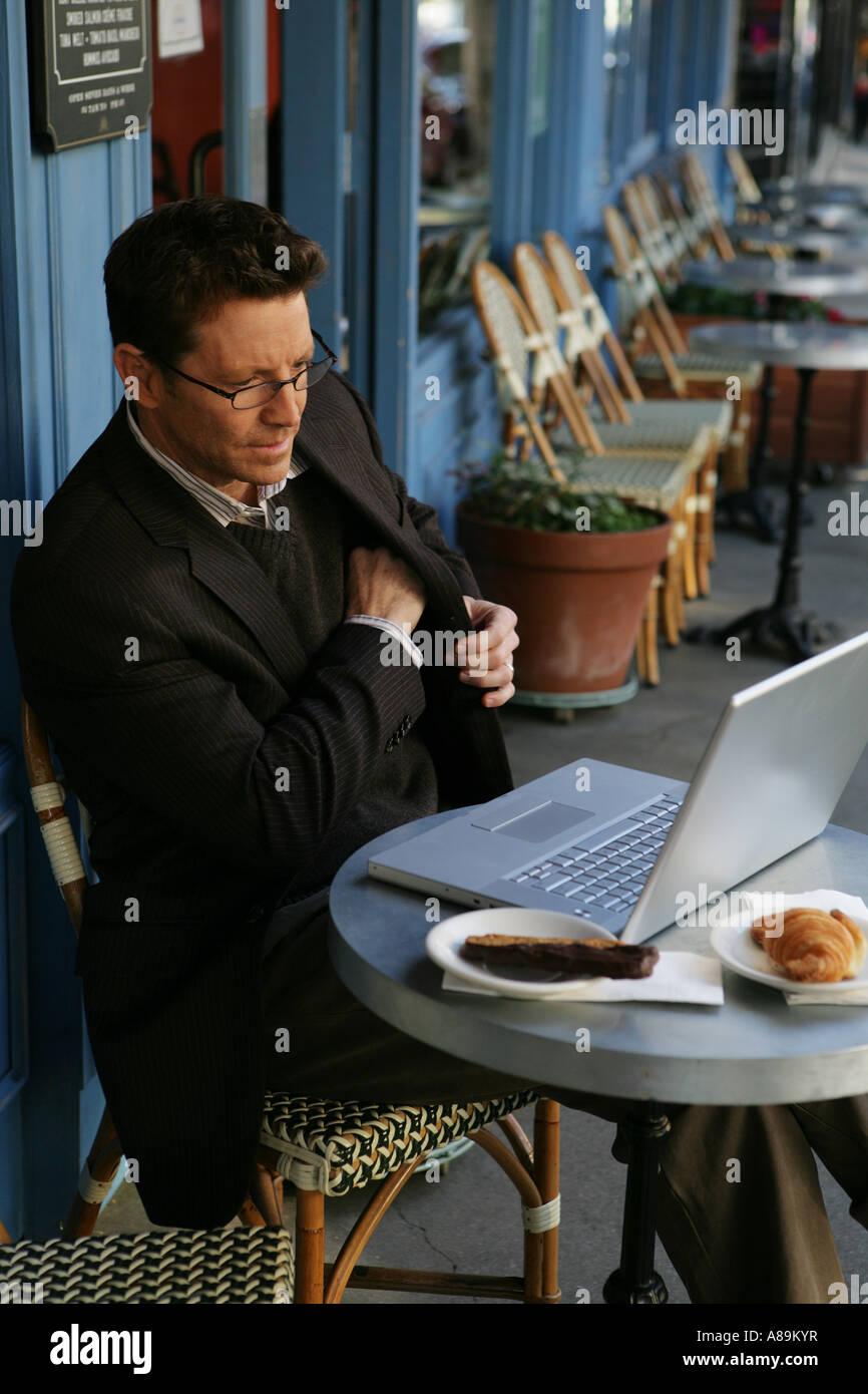 Mature man getting something from his inside pocket Stock Photo - Alamy
