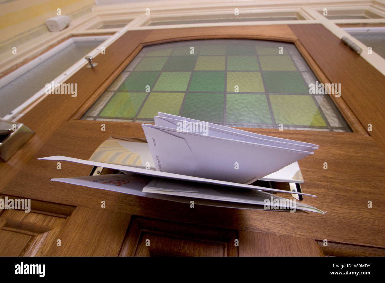 looking up at mail letters post being delivered to house through ...