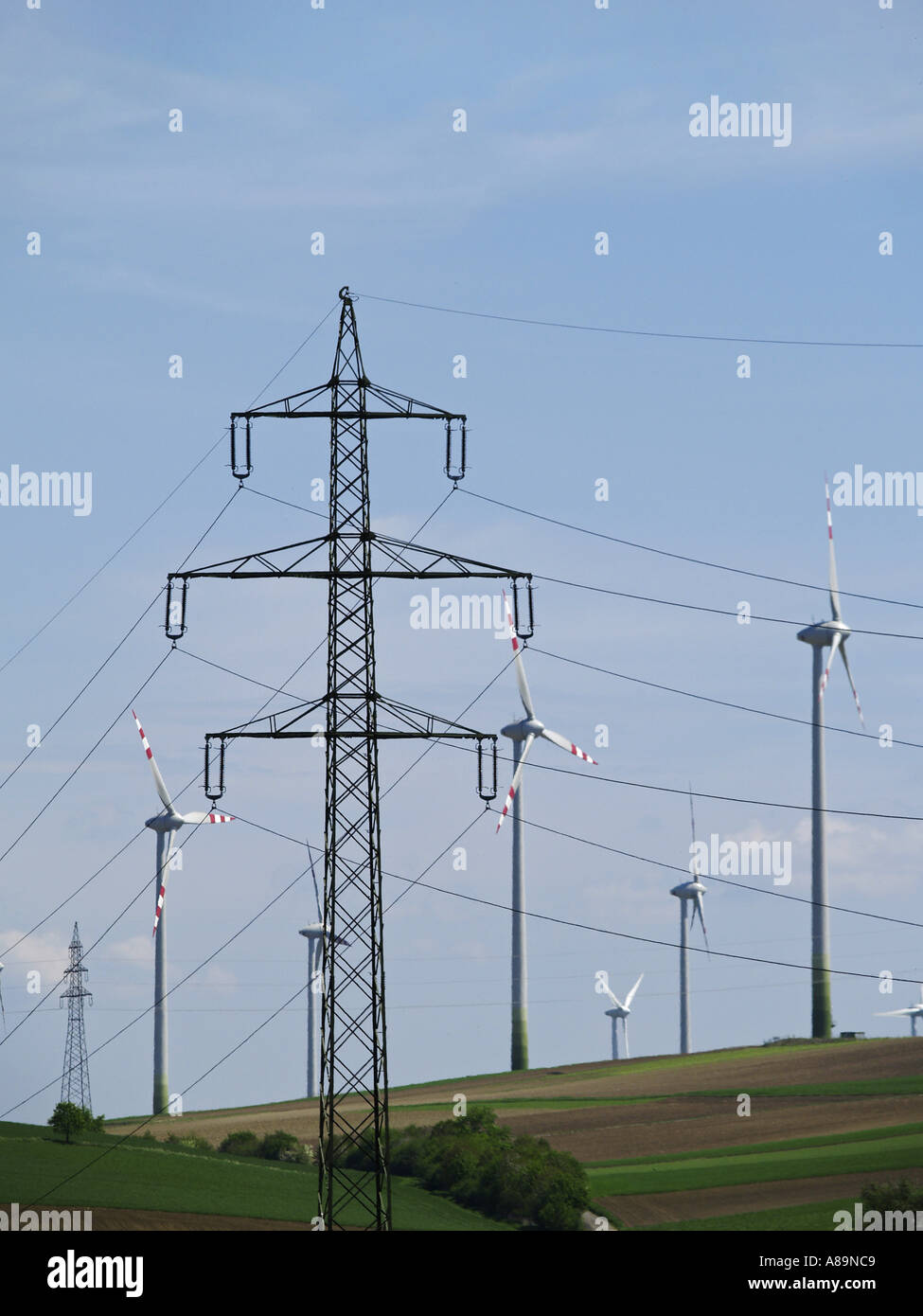 electricity, power pole, high-voltage line, wind turbines Stock Photo ...