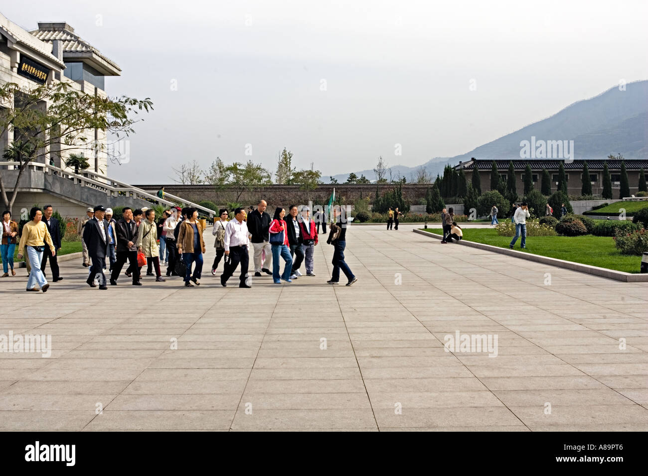 CHINA XI AN Chinese tour group following tour guide with flag at the ...