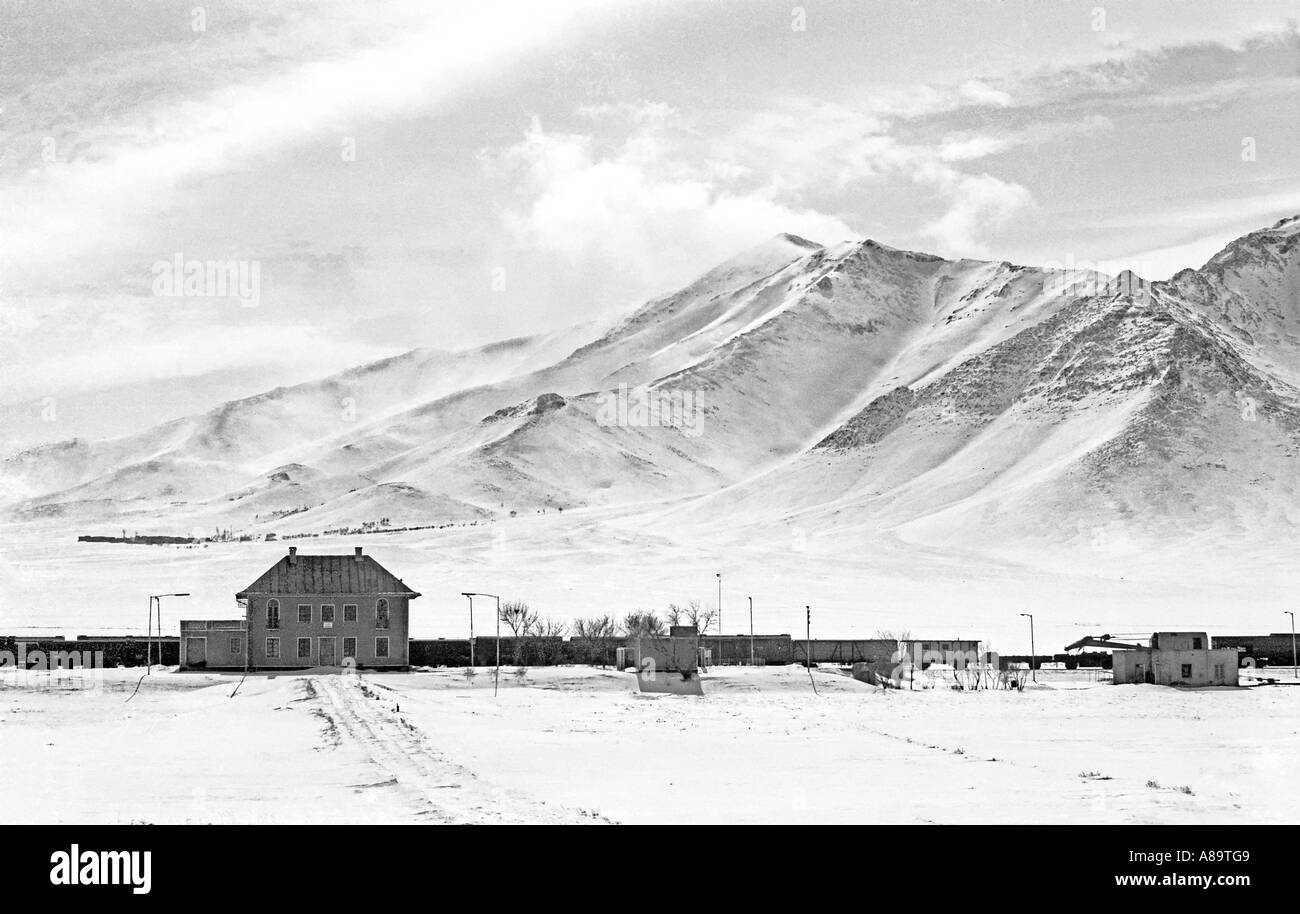 IRAN ARAK Remote train station on a snowy plateau in the mountains of ...