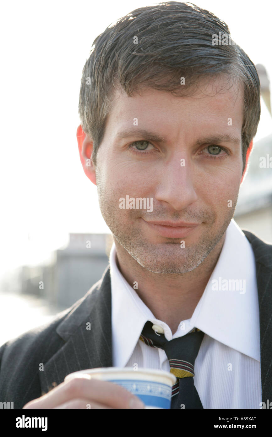 Man wearing a suit and tie looking at camera Stock Photo - Alamy