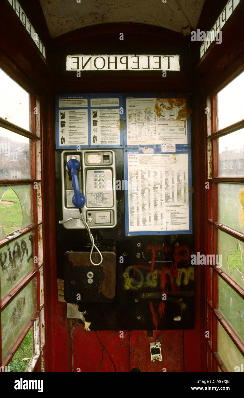 Communication K6 phone box vandalised interior Stock Photo - Alamy
