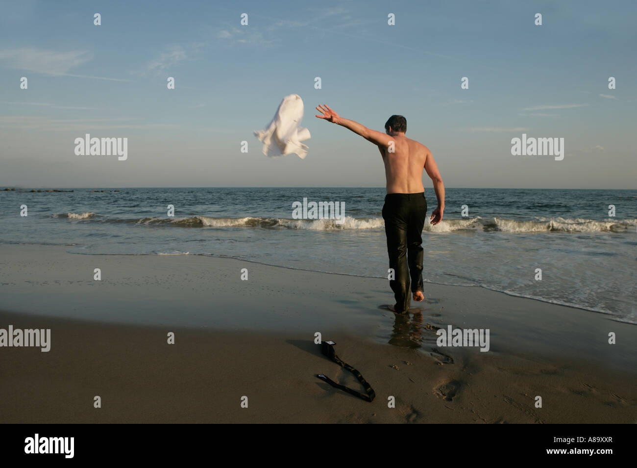 Man tossing off his shirt Stock Photo - Alamy