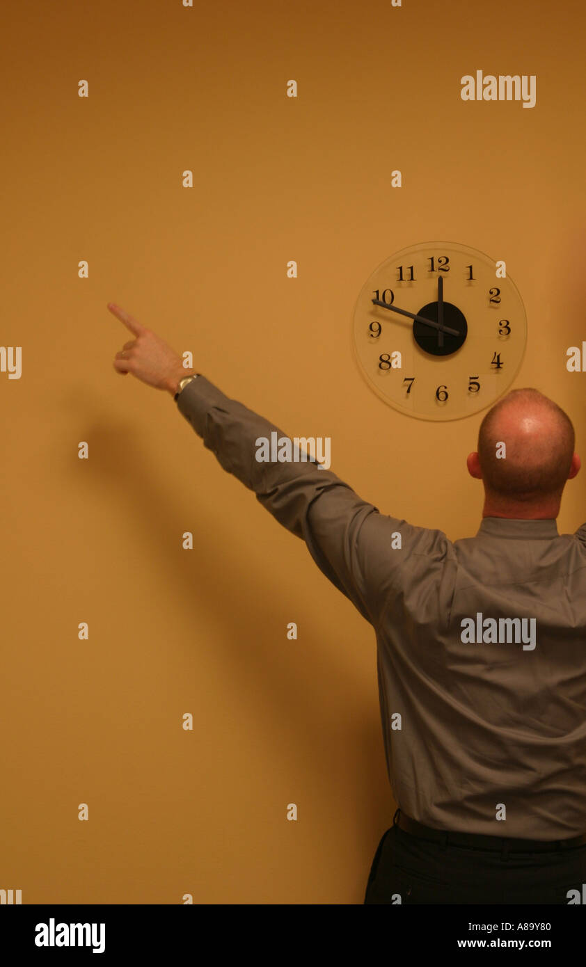 Watching the clock two Stock Photo - Alamy