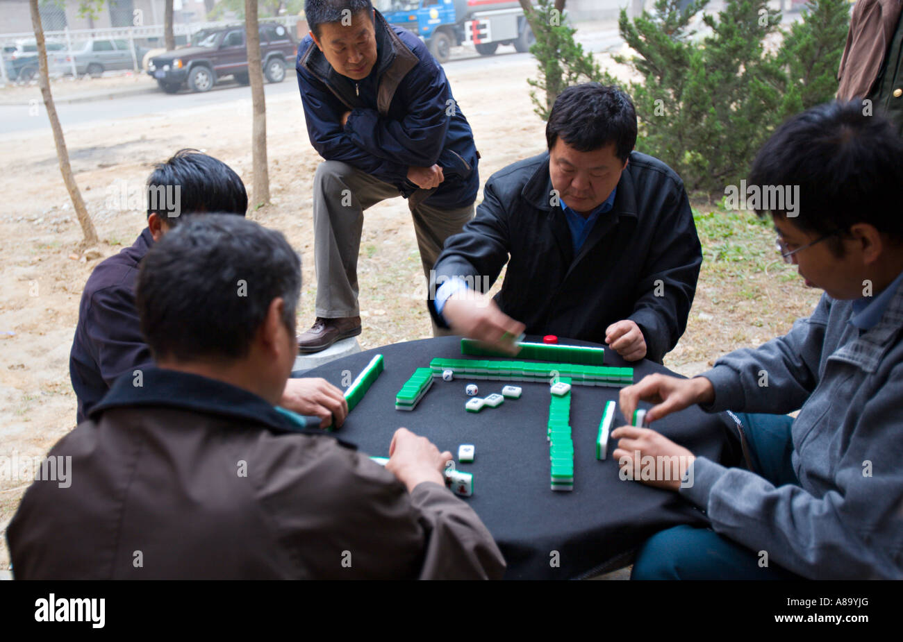 CHINA BEIJING Chinese men playing mahjong a traditional Chinese game of ...