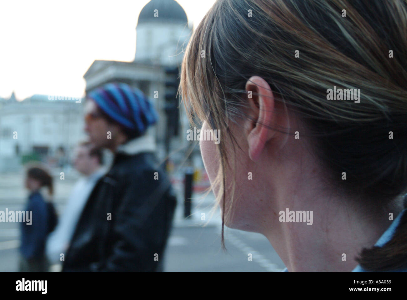 Woman looking over shoulder fear hi-res stock photography and images ...