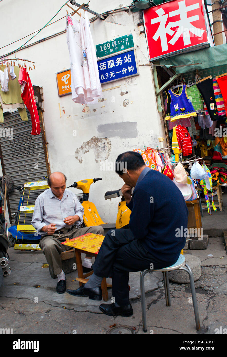 CHINA SHANGHAI Chinese men playing xiangqi or Chinese chess a ...