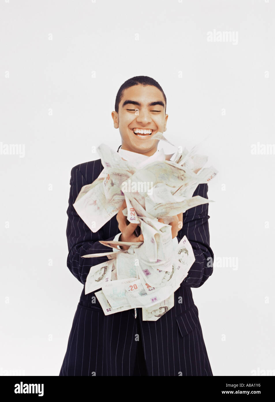 Businessman with lots of money Stock Photo - Alamy
