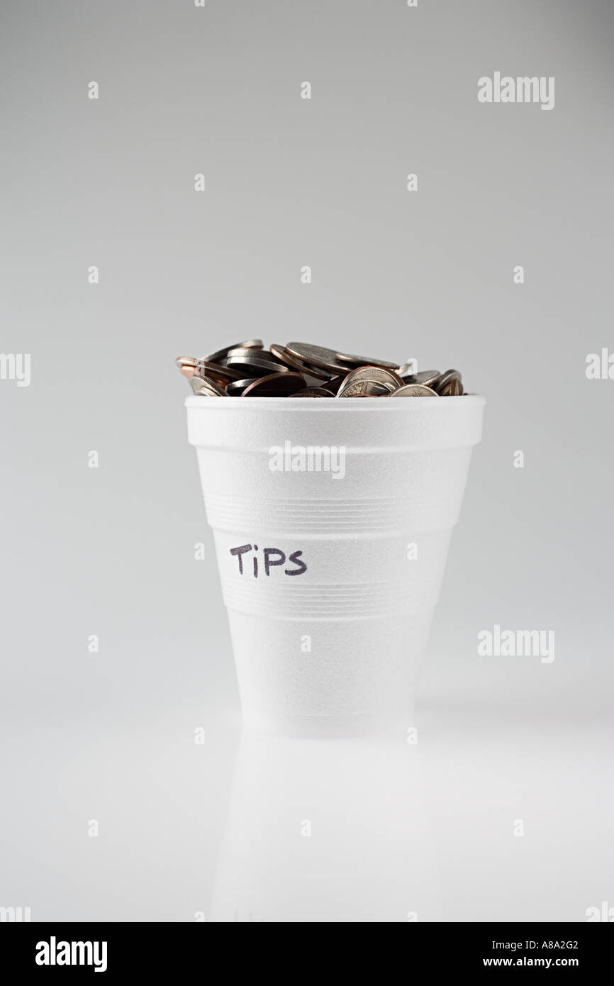 Full tip cup Stock Photo - Alamy