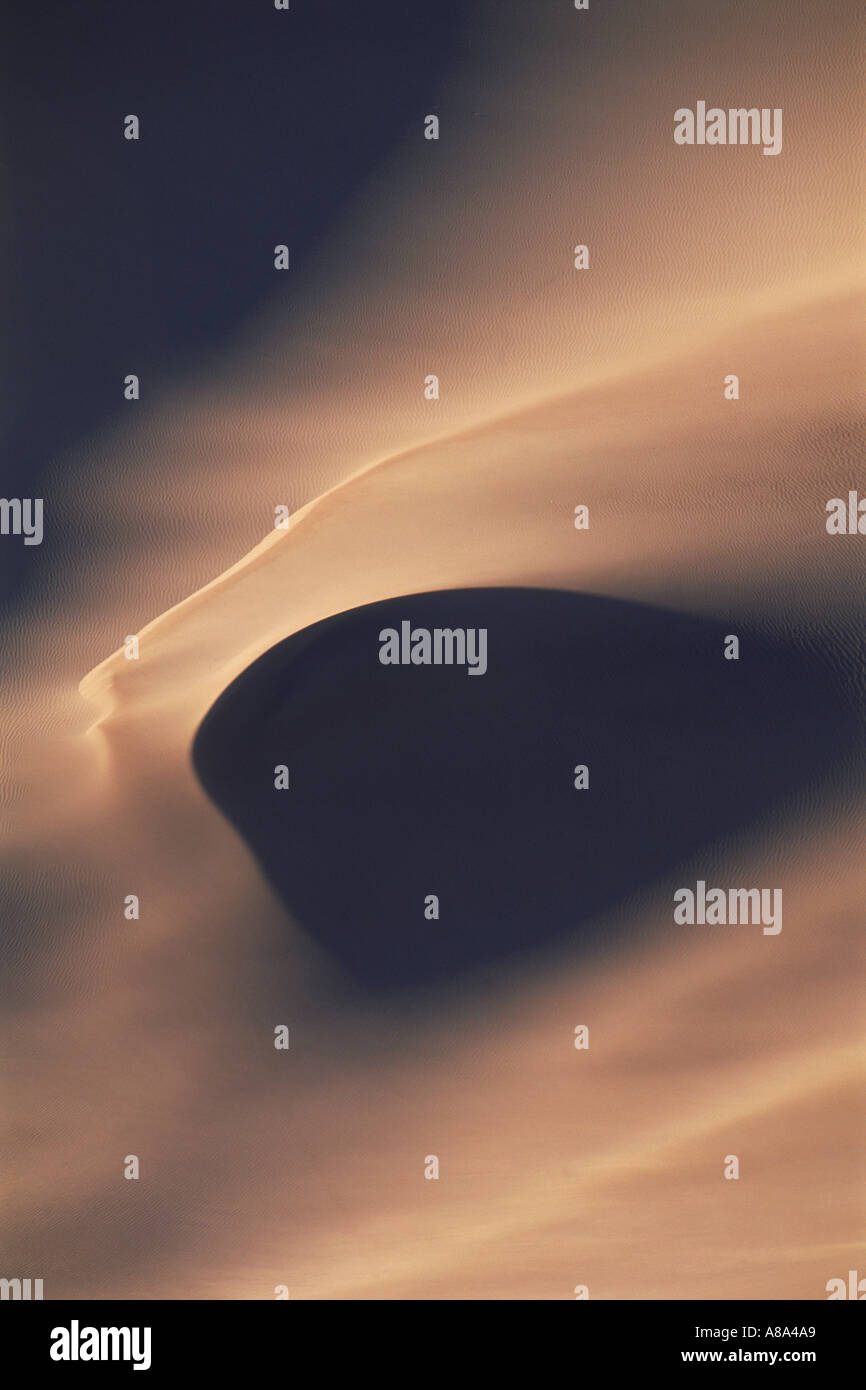 Shadows across sand dune in low light Stock Photo - Alamy