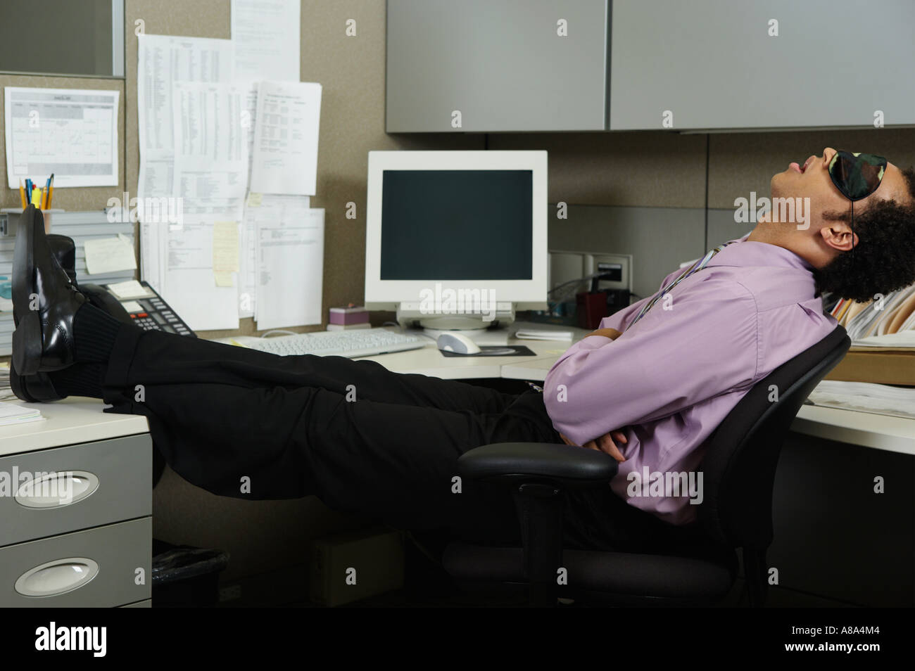 Businessman sleeping at his desk Stock Photo - Alamy