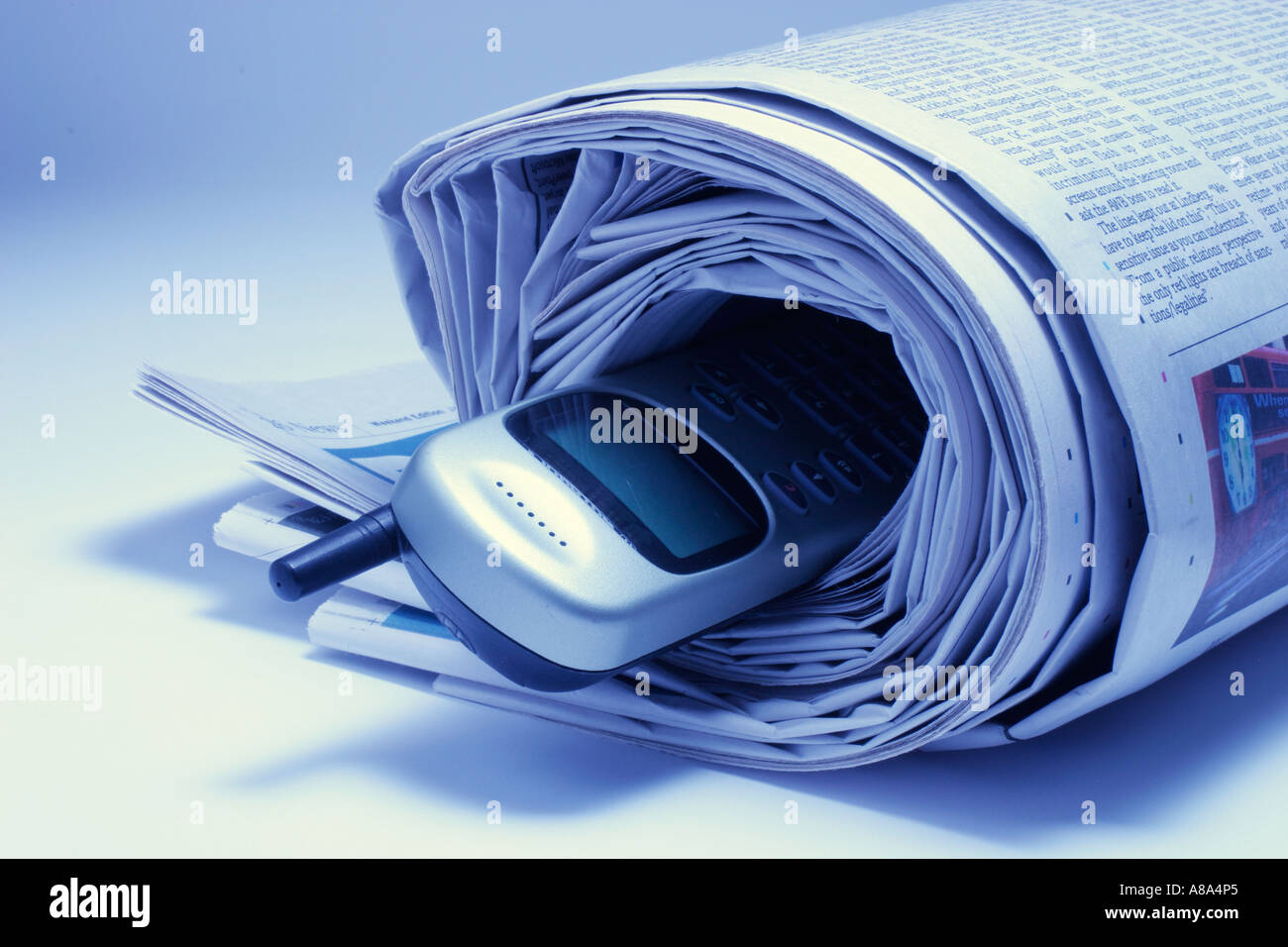 Mobile Phone and Newspapers Stock Photo - Alamy