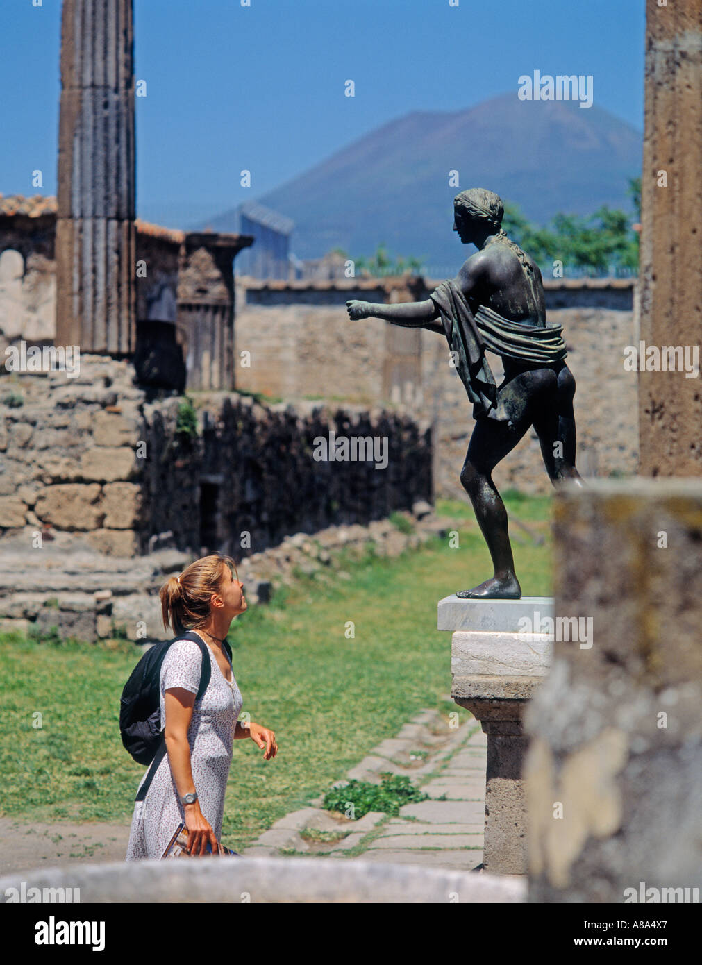 Pompeii, Italy. Visitor admiring statue of Apollo the Archer in ...