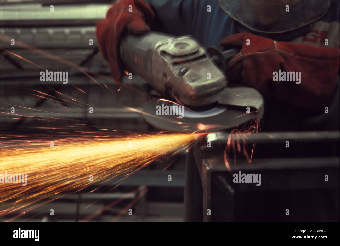 man using a metal grinder Stock Photo - Alamy