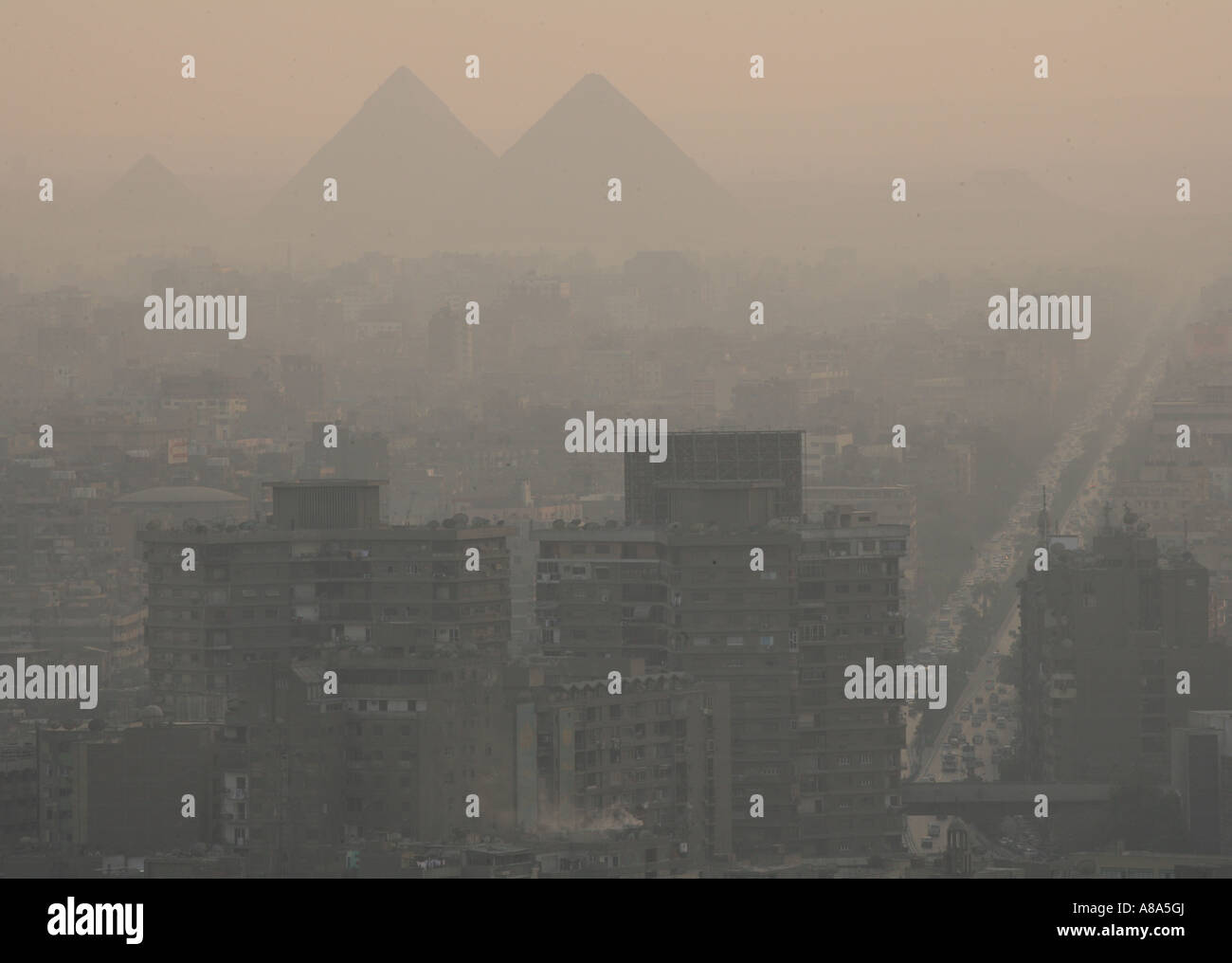 Hazy Cairo cityscape and the pyramids skyline, Egypt, Middle East Stock ...