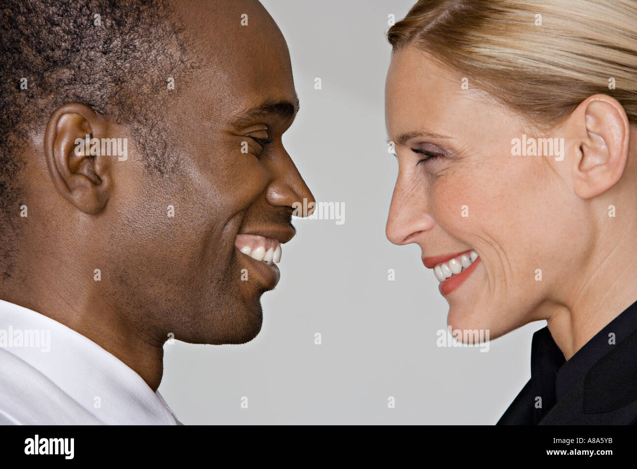 Smiling couple face to face Stock Photo - Alamy