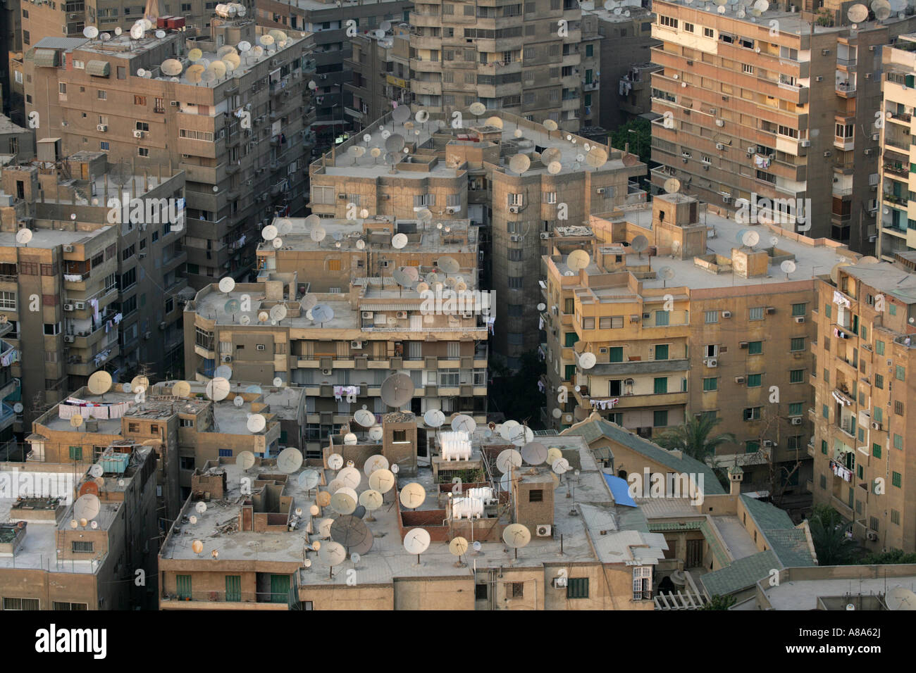 Downtown Cairo cityscape with satellite dishes scattered over rooftops ...