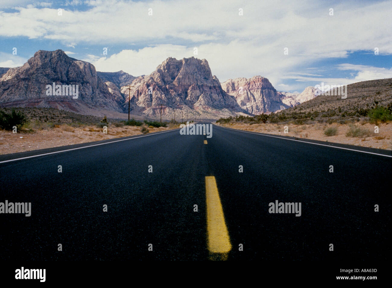 Horizontal color image of straight desert road in the desert of Nevada ...