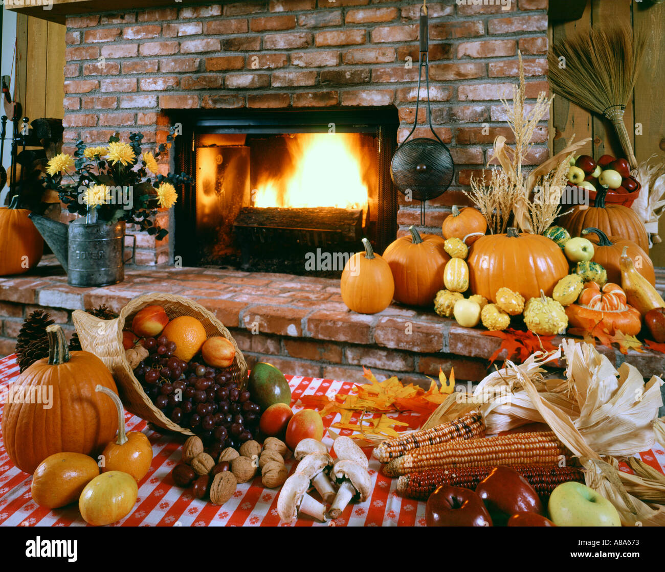 Harvest still life with fireplace ablaze Stock Photo - Alamy