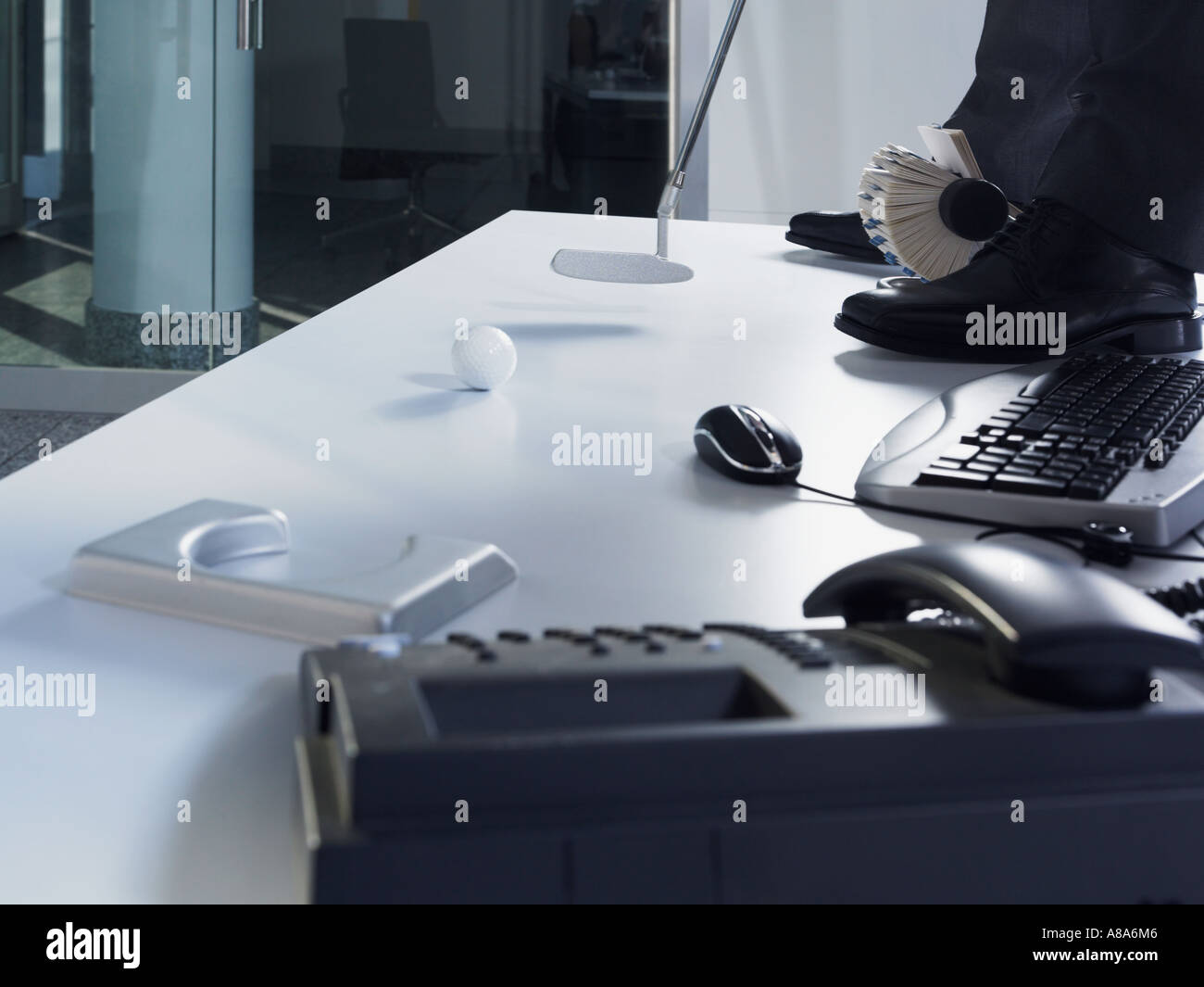Playing golf on the desk Stock Photo - Alamy