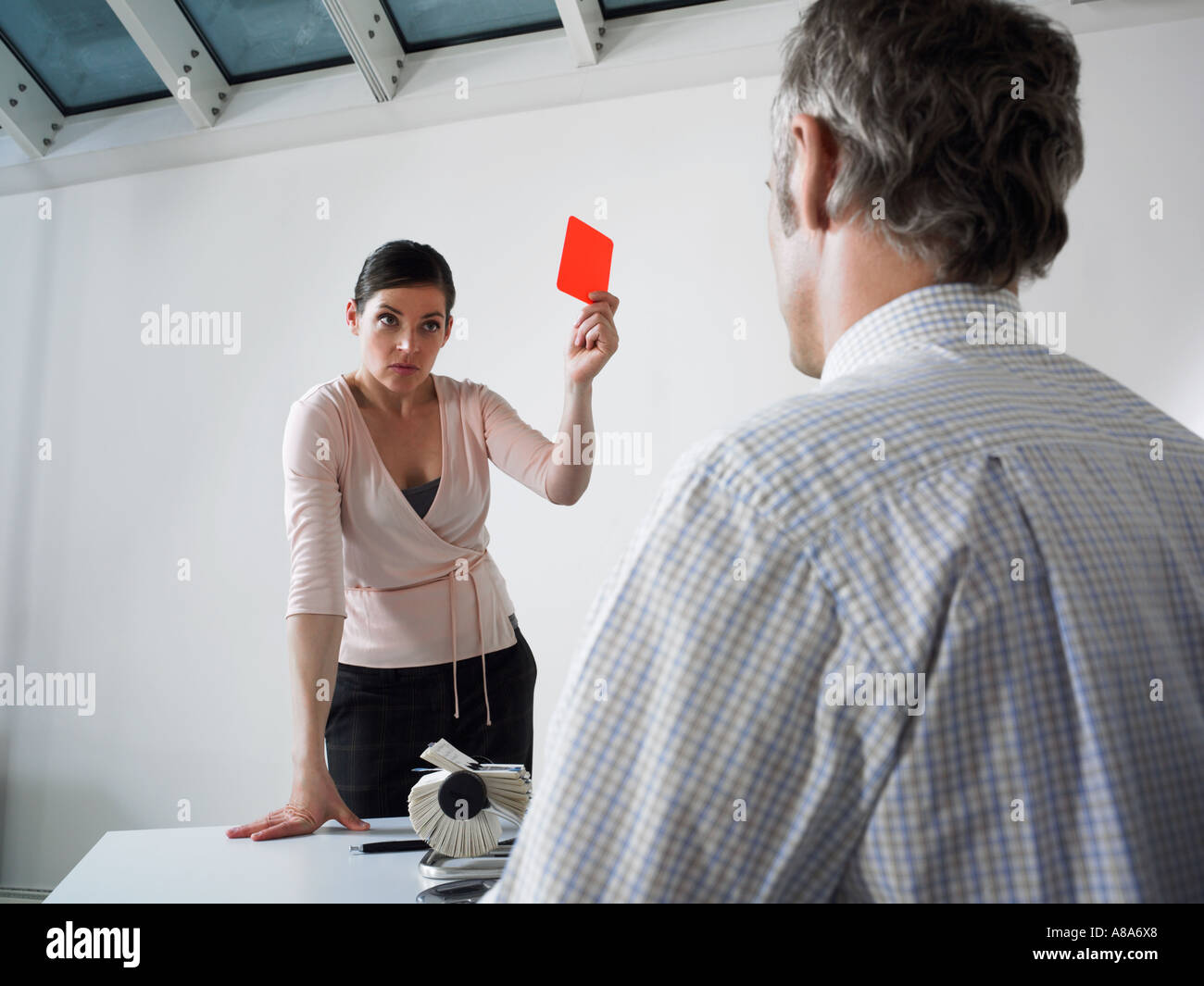 Boss giving the red card Stock Photo - Alamy