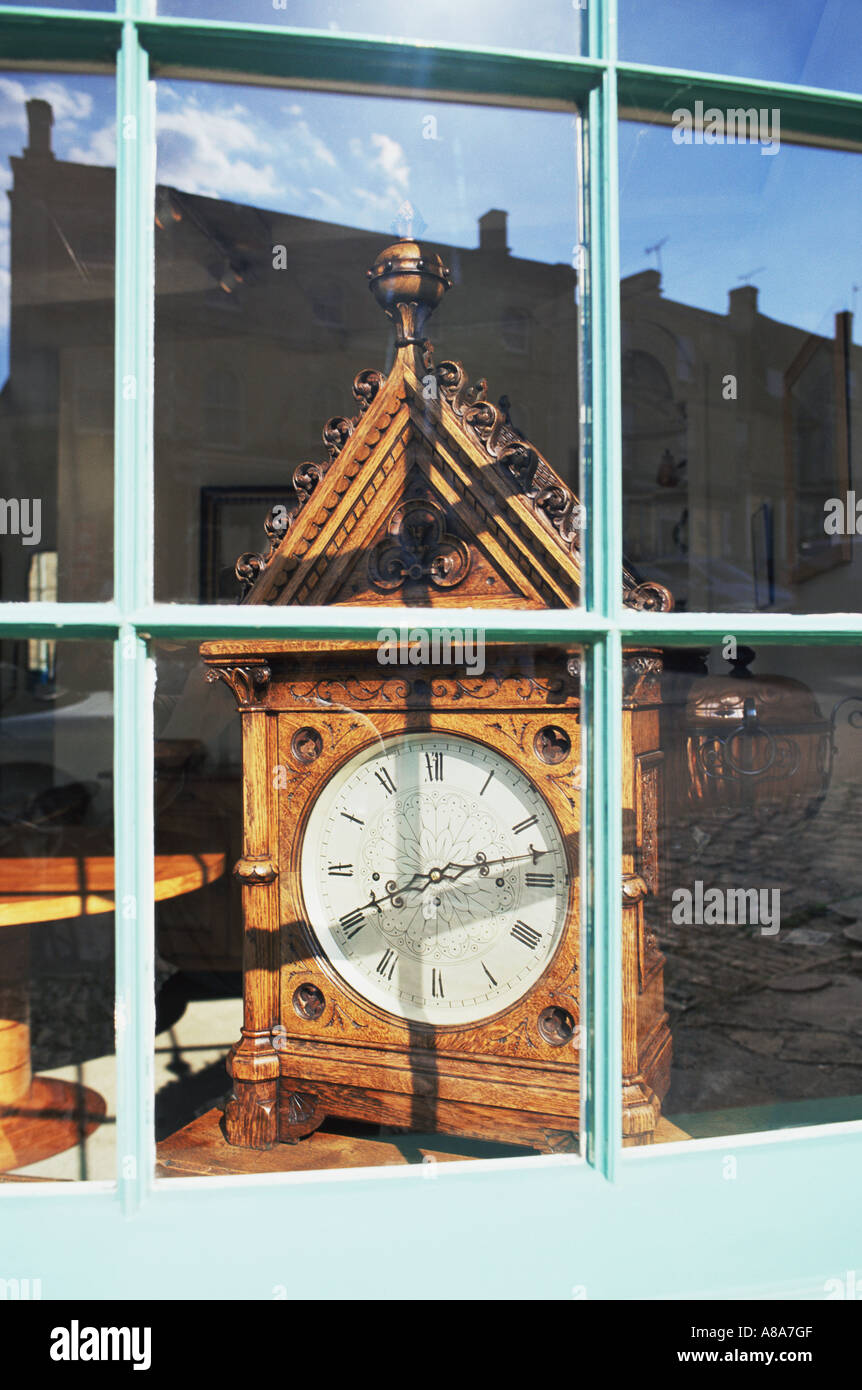 Carriage clock through window Stock Photo - Alamy