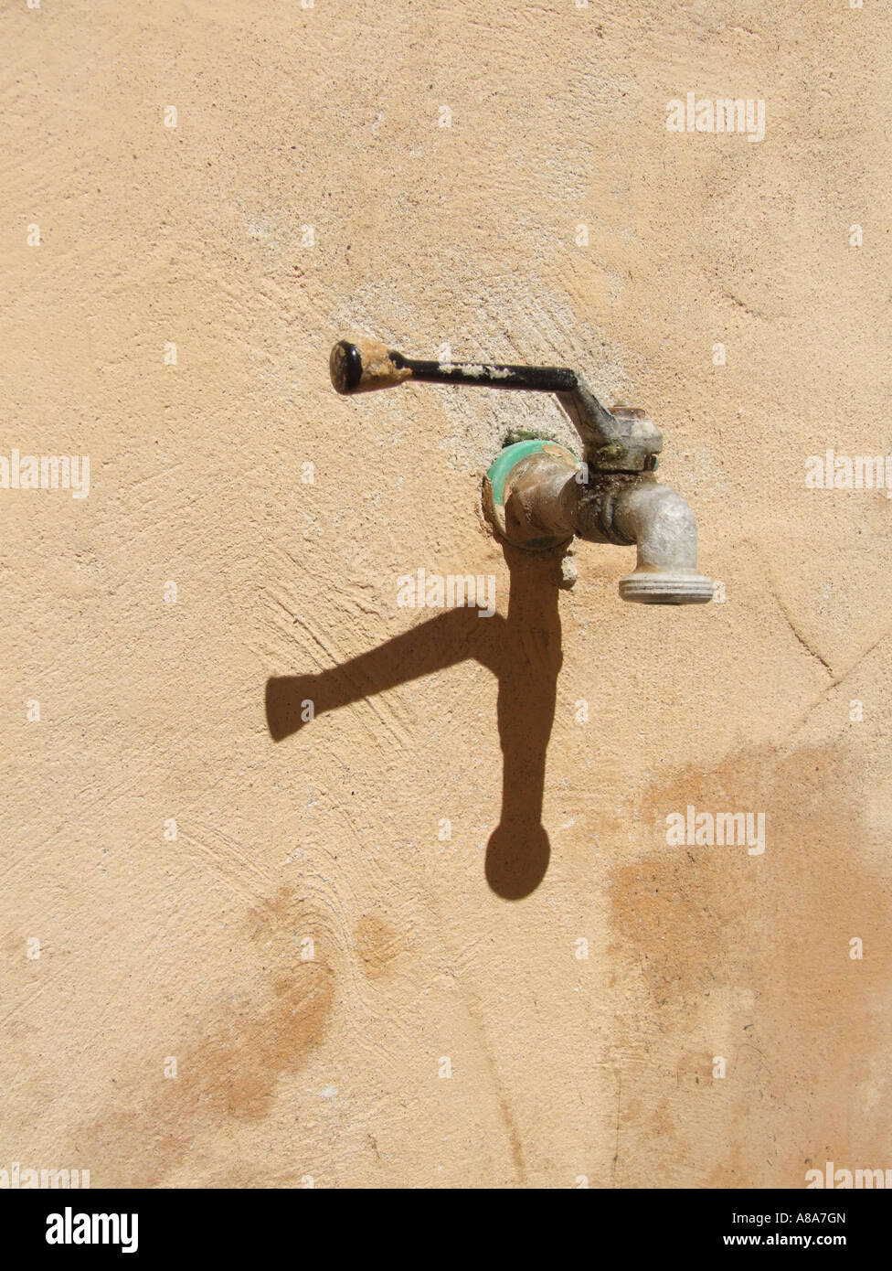 one tap on outside wall Stock Photo - Alamy