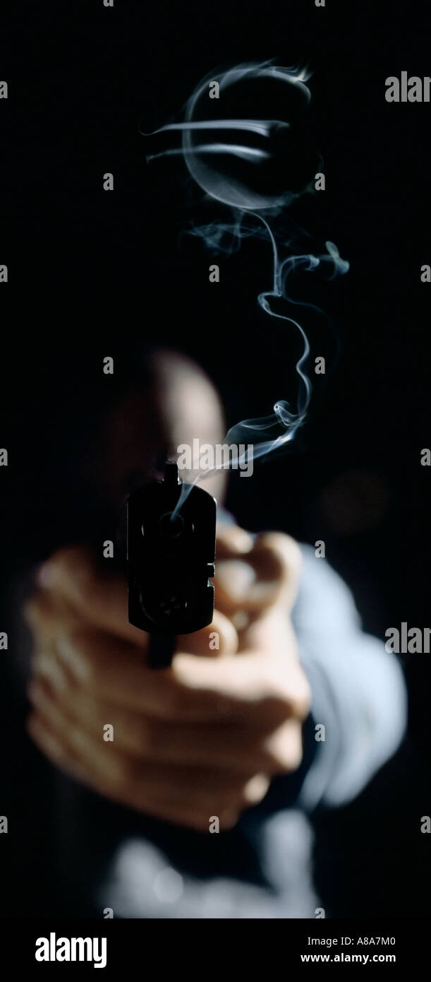 Euro sign in gun smoke Stock Photo - Alamy
