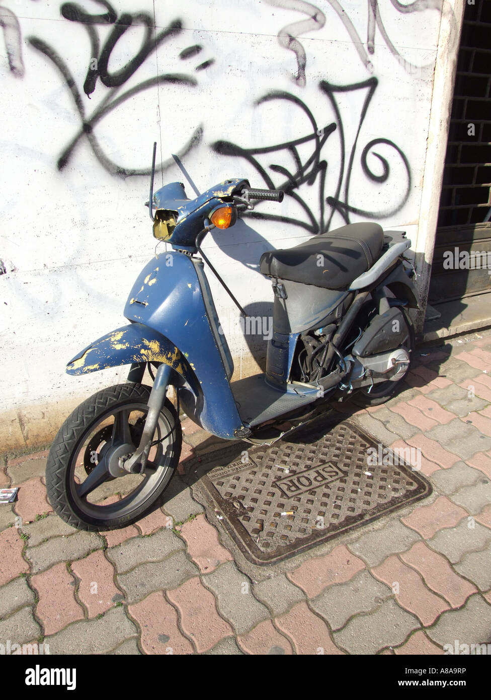 abandoned scooter moped in street in rome italy Stock Photo - Alamy