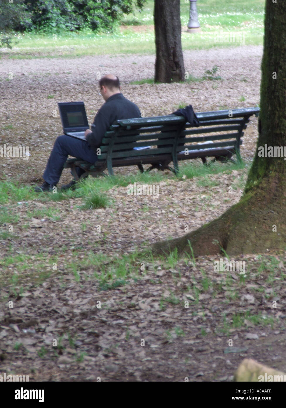 man working on laptop outdoors Stock Photo - Alamy