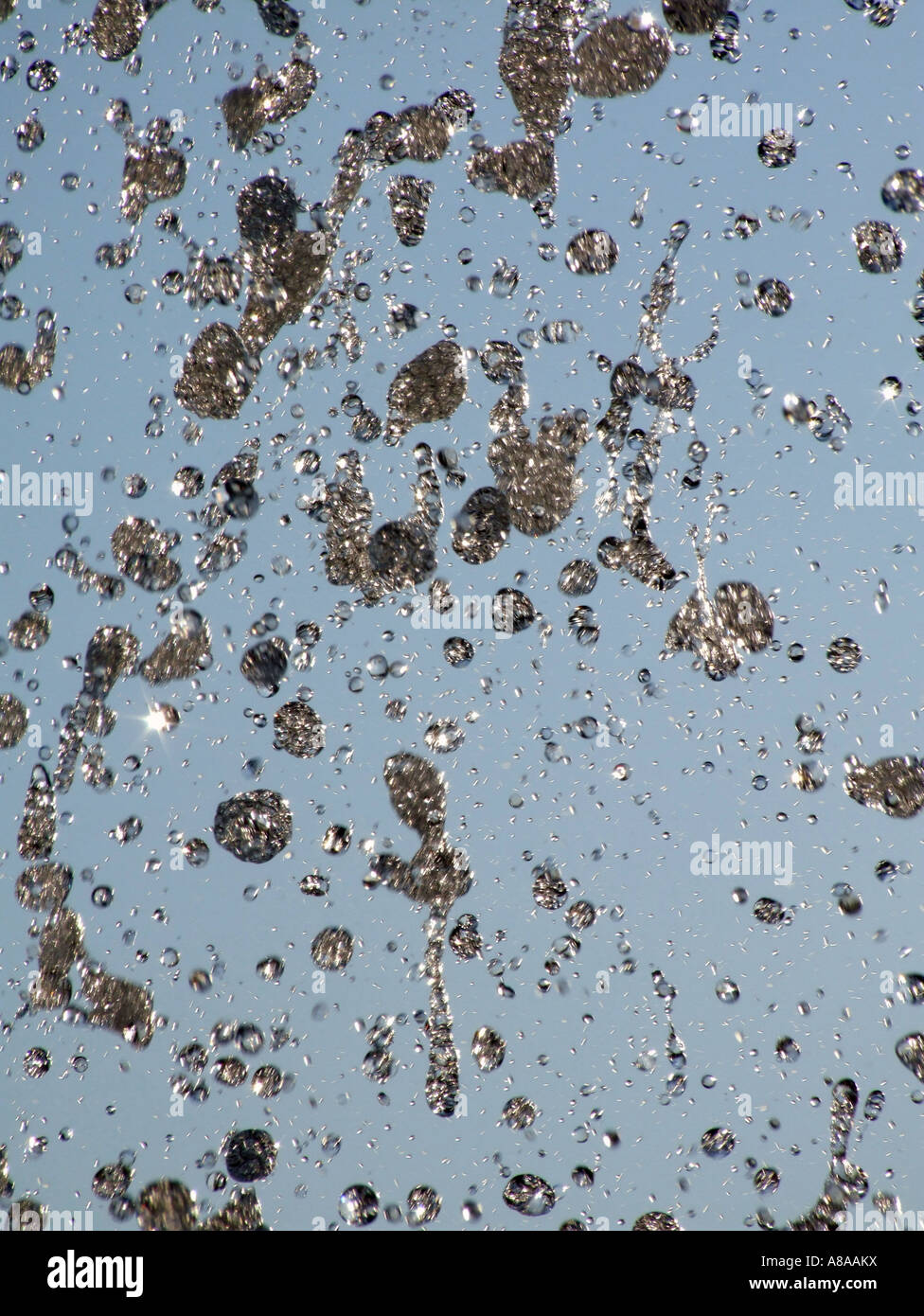 Backlit water drops from spray hi-res stock photography and images - Alamy