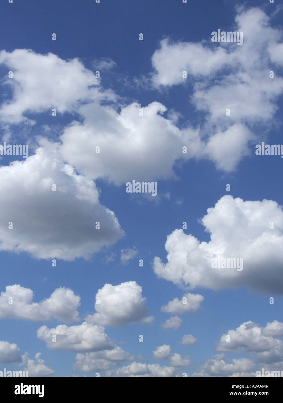 dramatic fluffy white clouds and blue sky Stock Photo - Alamy
